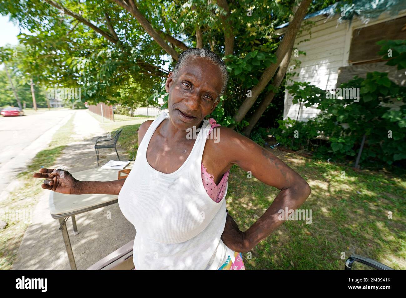Linda Collier stands under a shade tree near her home in the historic Farish Street District, to ...
