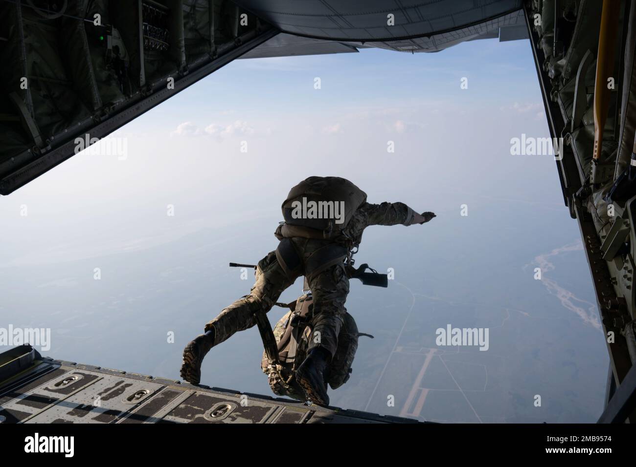 A U.S. Army 1st Special Forces Group team member conducts a military free fall jump over ...