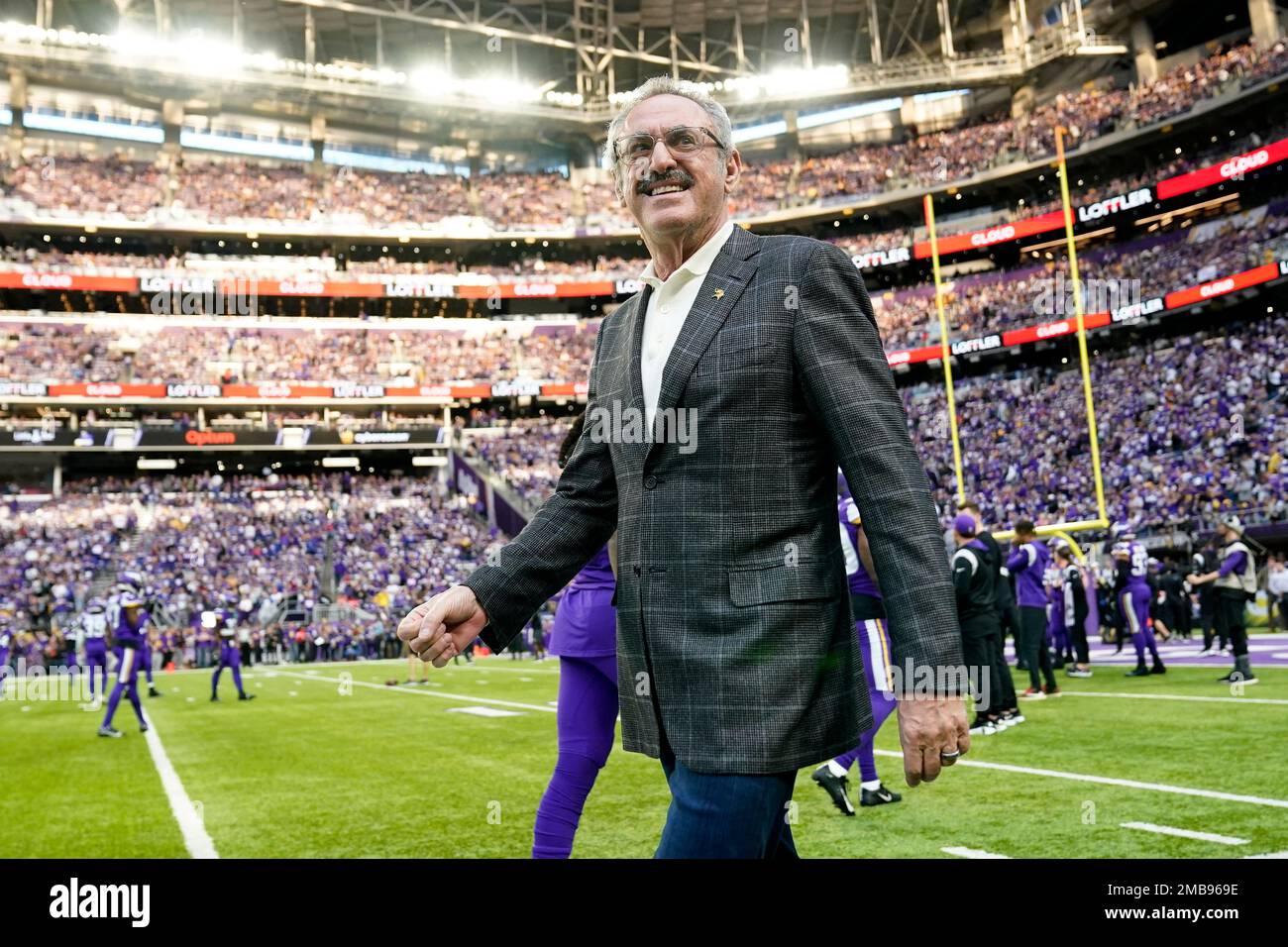 Minnesota Vikings owner Zygi Wilf walks on the field before an NFL wild ...
