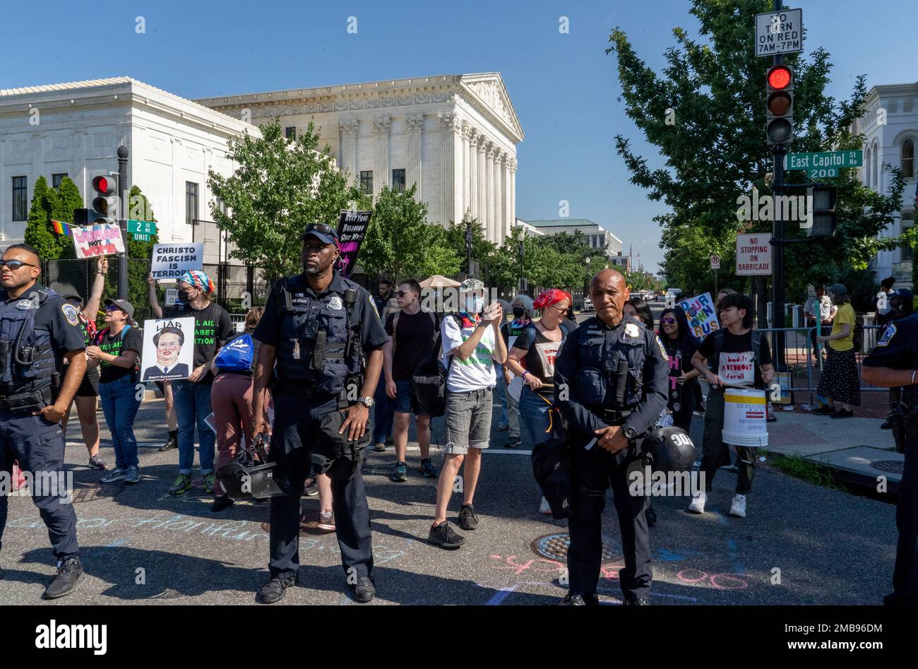 U.S. Capitol Police officers stand near abortion-rights protesters ...