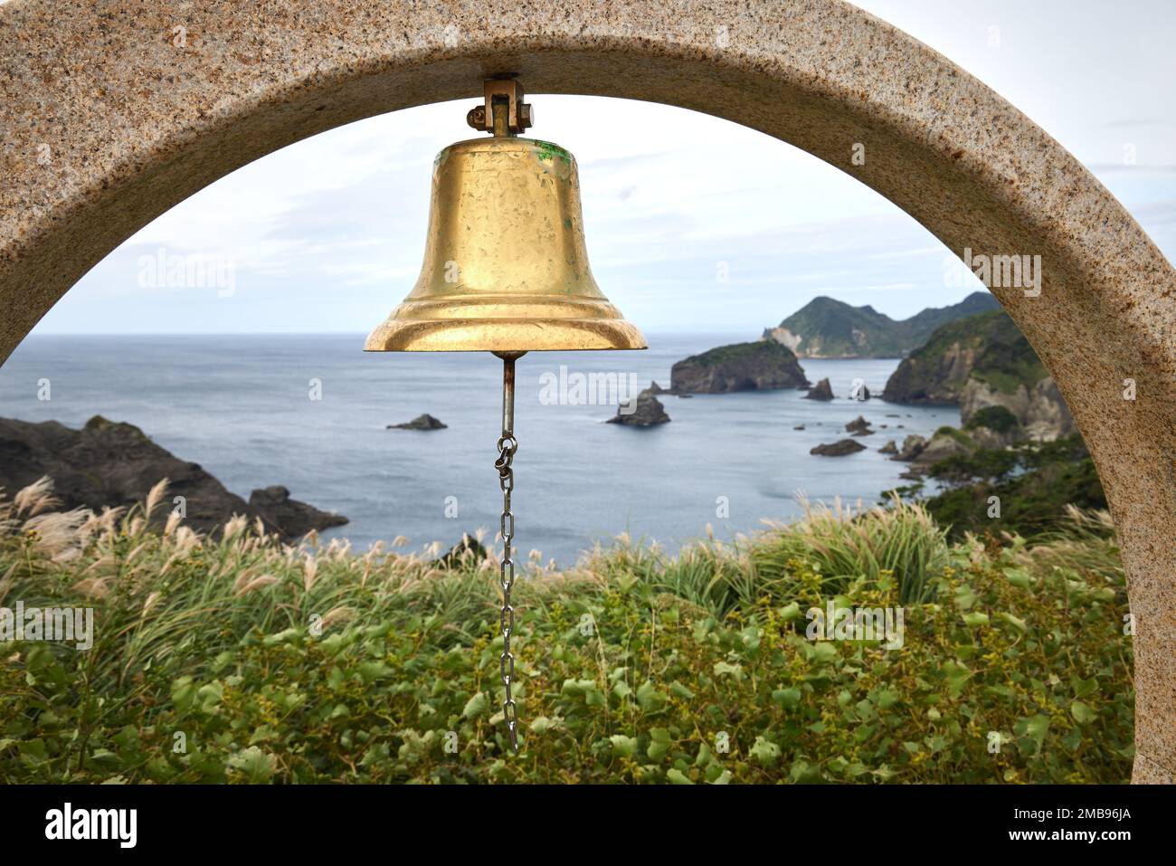 Detail of the golden bell at the Cape Aiai Stock Photo - Alamy