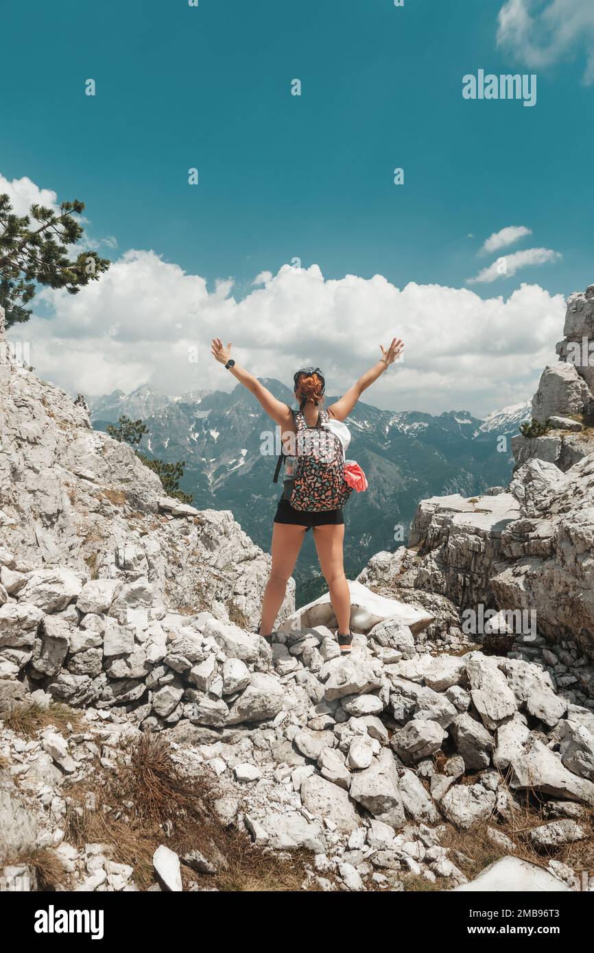 A hiker girl travels with a backpack in the Prokletie mountains ...