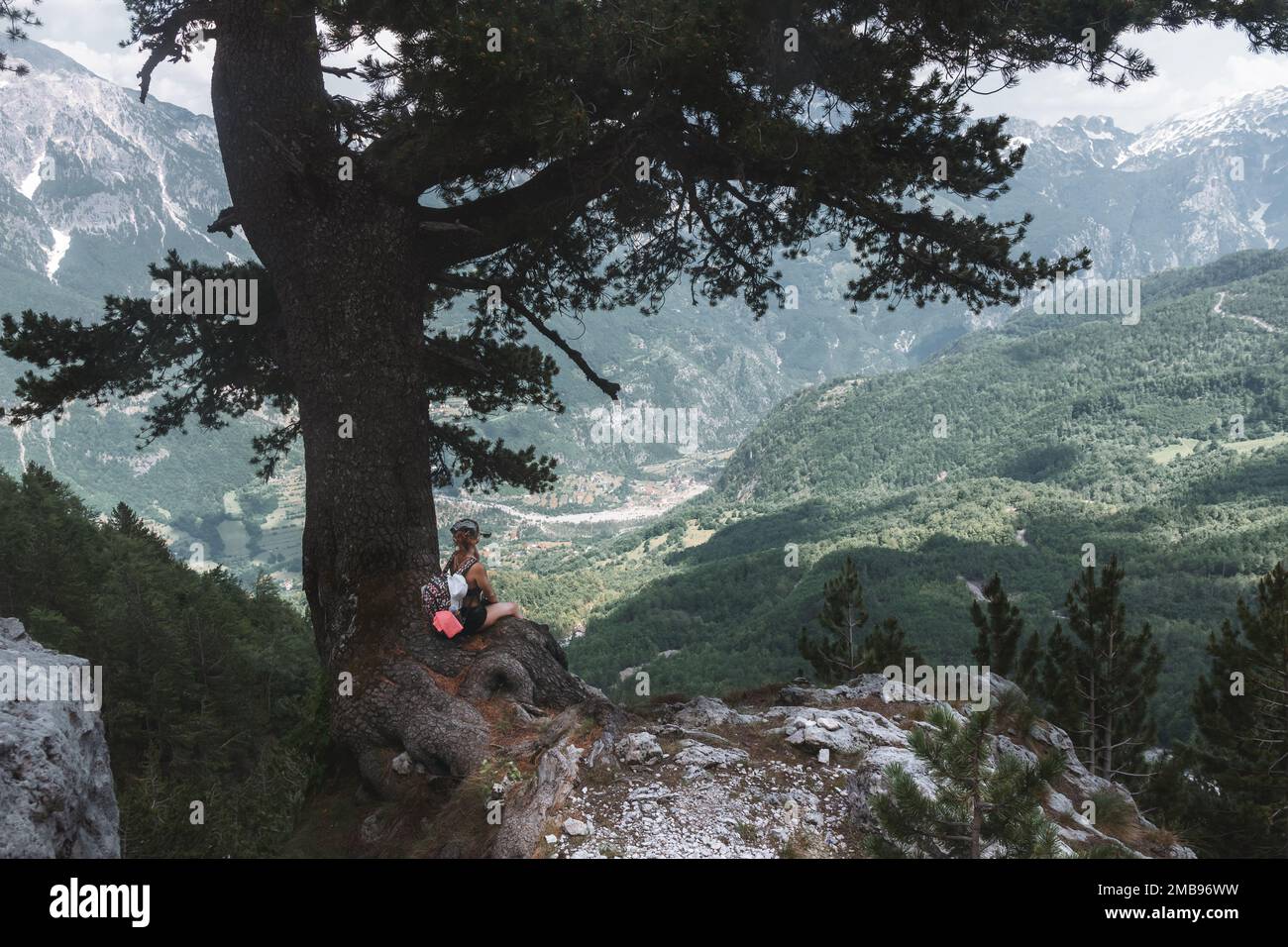A hiker girl travels with a backpack in the Prokletie mountains ...