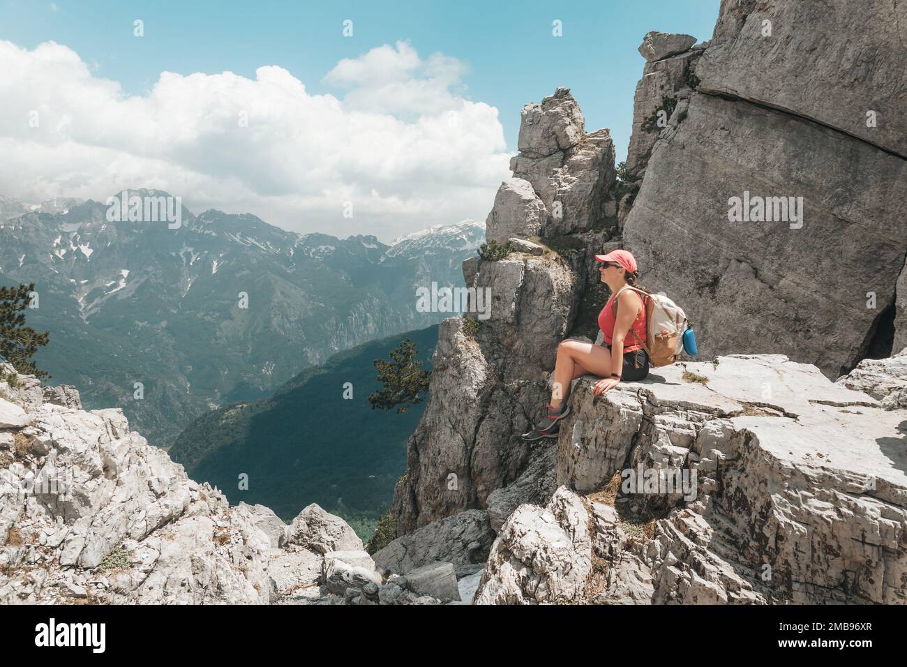 A hiker girl travels with a backpack in the Prokletie mountains ...