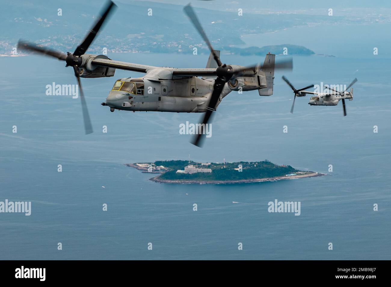 U.S. Marine Corps MV-22B Ospreys, assigned to Marine Medium Tiltrotor Squadron (VMM) 265, fly in ...