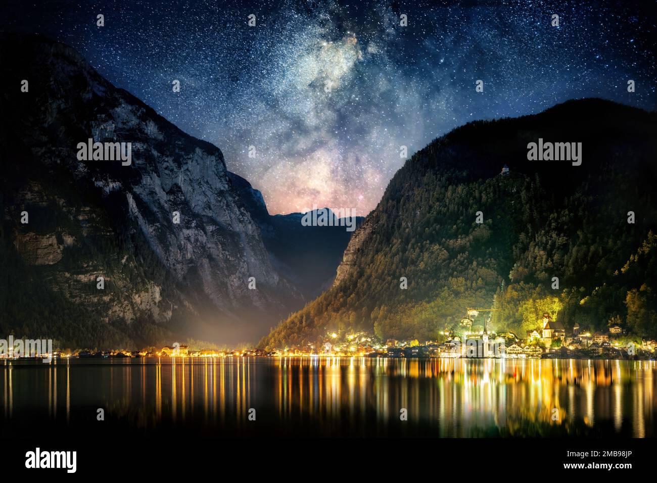 Night sky with the Milky Way and mountains over the iconic town of ...