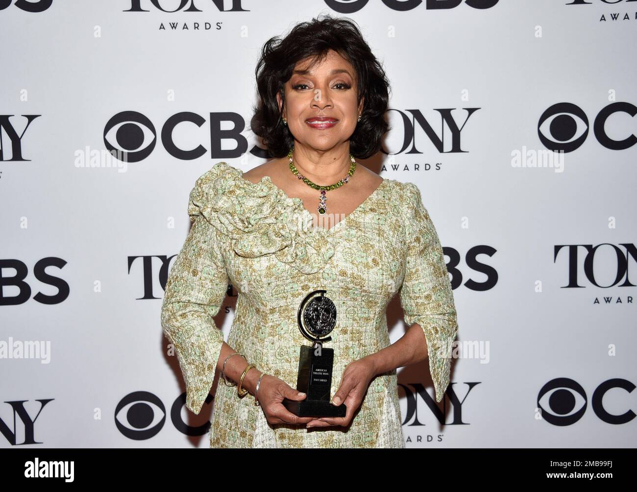 Phylicia Rashad poses in the press room with the award for best ...