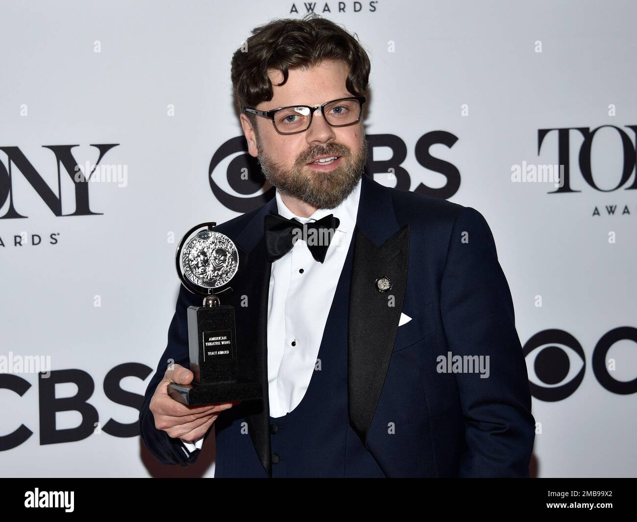 Mikhail Fiksel poses in the press room with the award for best sound design of a play for "Dana ...