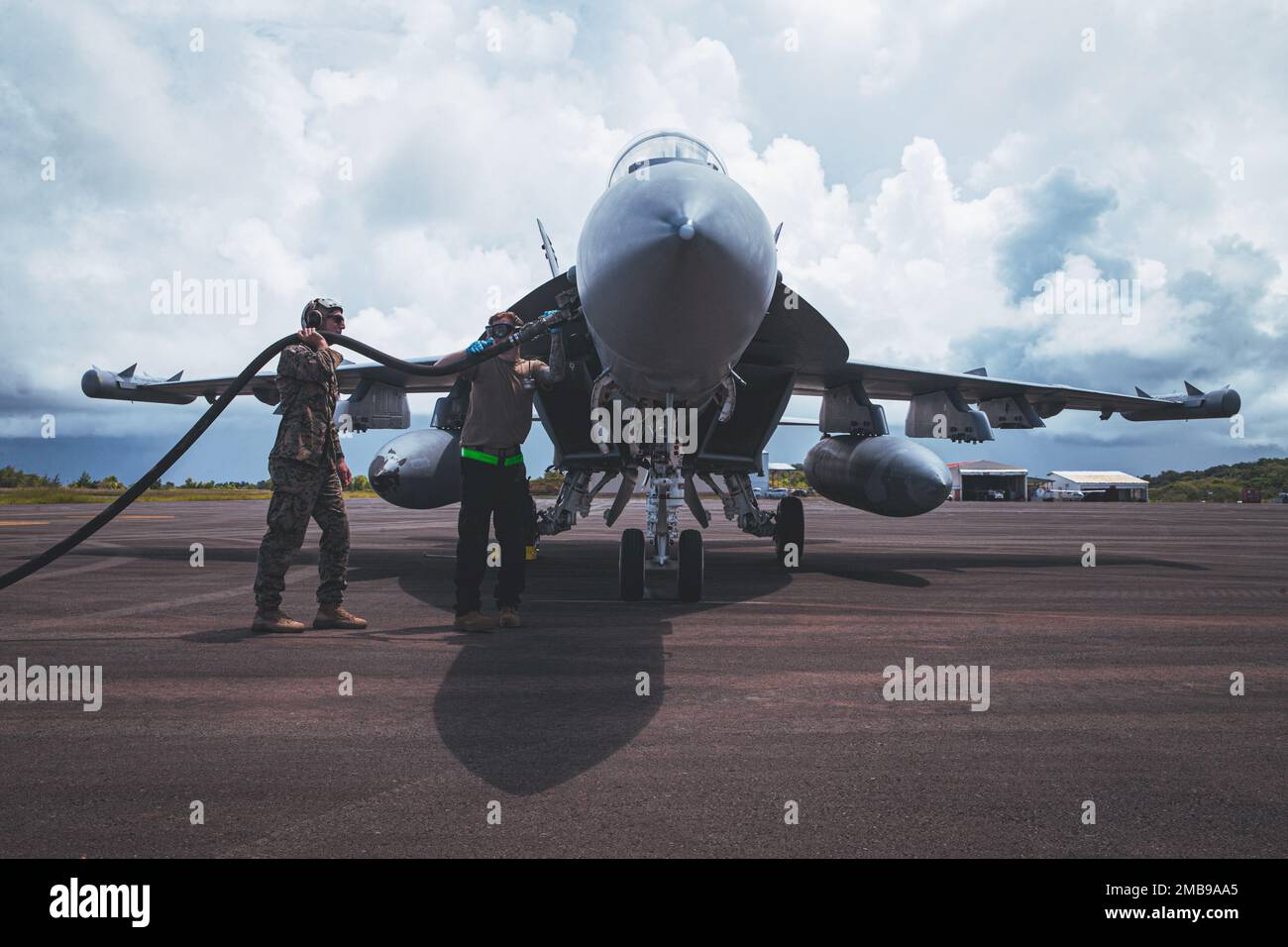 U.S. Marine Corps Gunnery Sgt. Thomas Orlowski (left), a track data ...