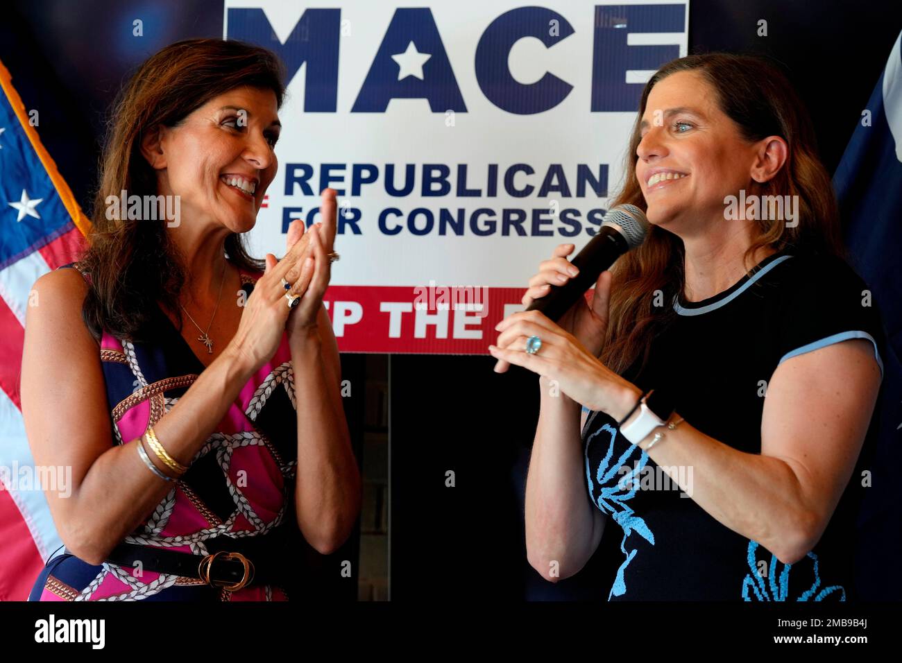 Former South Carolina Gov. Nikki Haley, left, claps alongside U.S. Rep ...