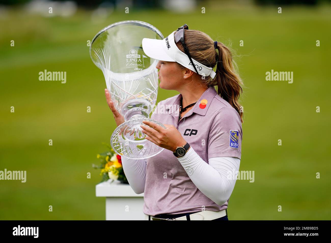 Brooke M. Henderson, of Canada, kisses the trophy after winning the ...