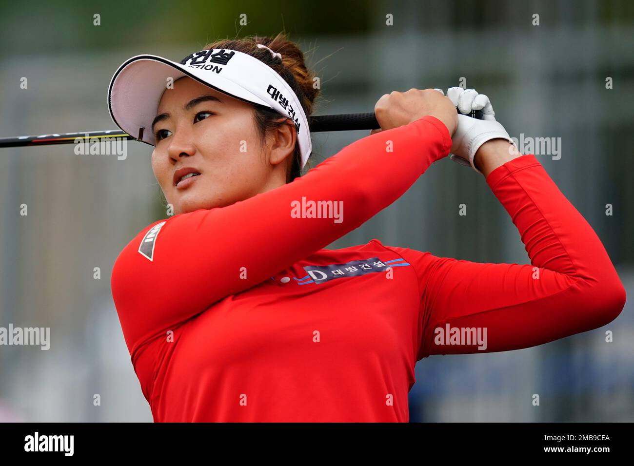 Su Oh, of Australia, watches her shot off the first tee during the ...