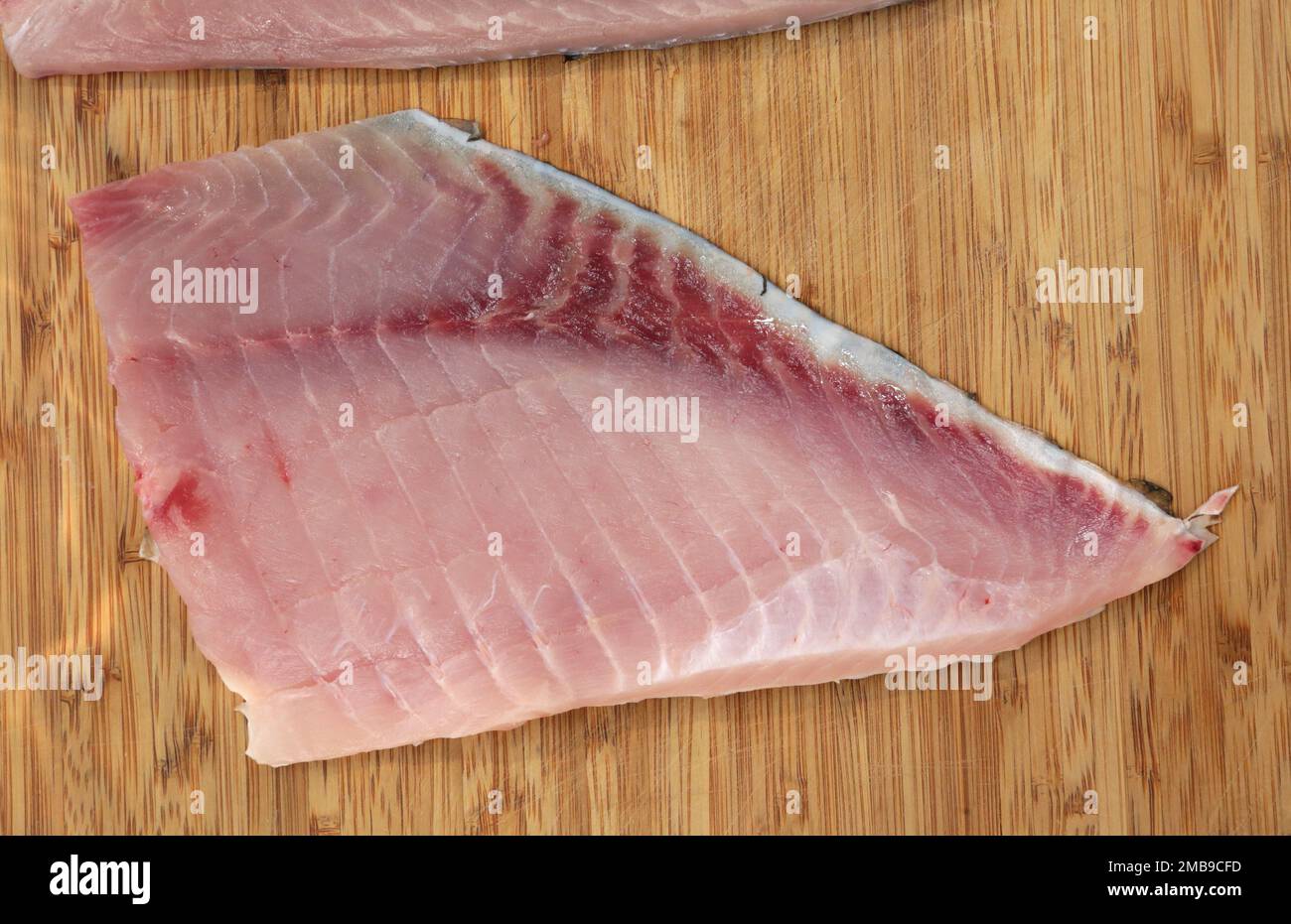 Raw carp fillet on cutting board Stock Photo - Alamy