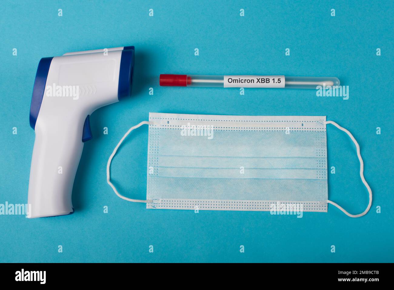 Top view of pyrometer near medical mask and cotton swab with omicron ...