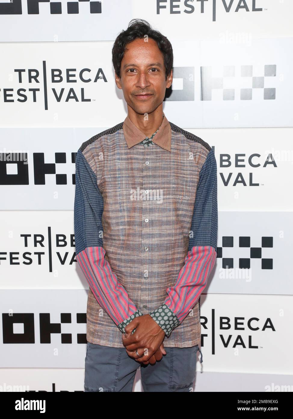 Actor Danny Pudi attends the premiere for "American Dreamer" at the ...
