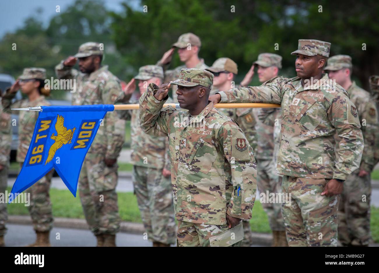 The 96th Medical Group formation salutes during a retreat ceremony June ...