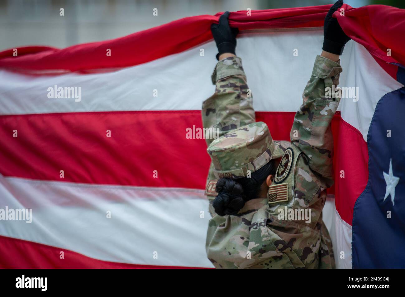 Senior Airman Arlyn Hixon, 96th Inpatient Operations Squadron, holds ...