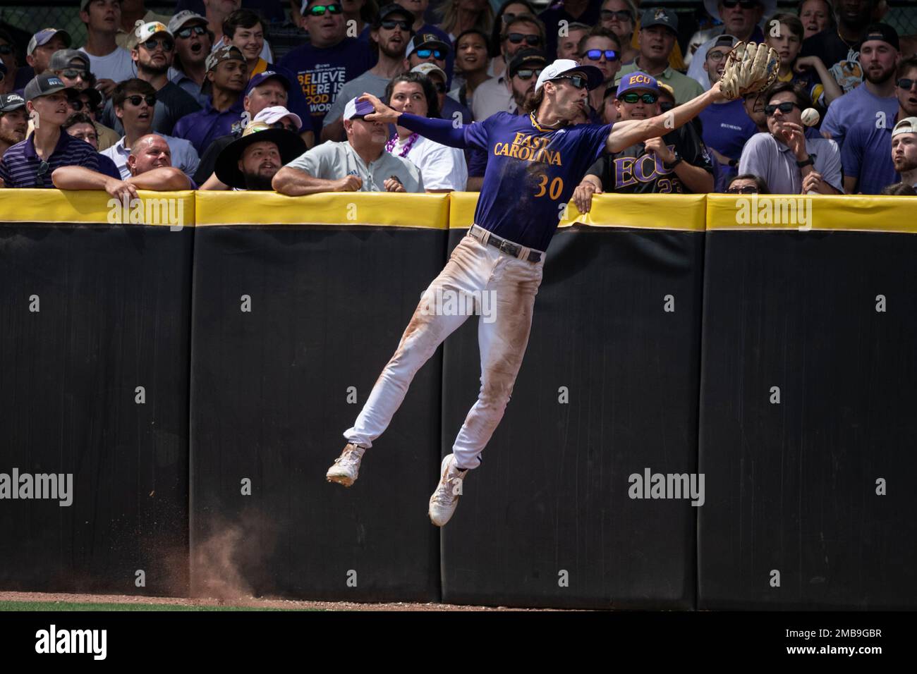 East Carolina's Jacob Jenkins-Cowart misses a ball hit by Texas' Trey ...