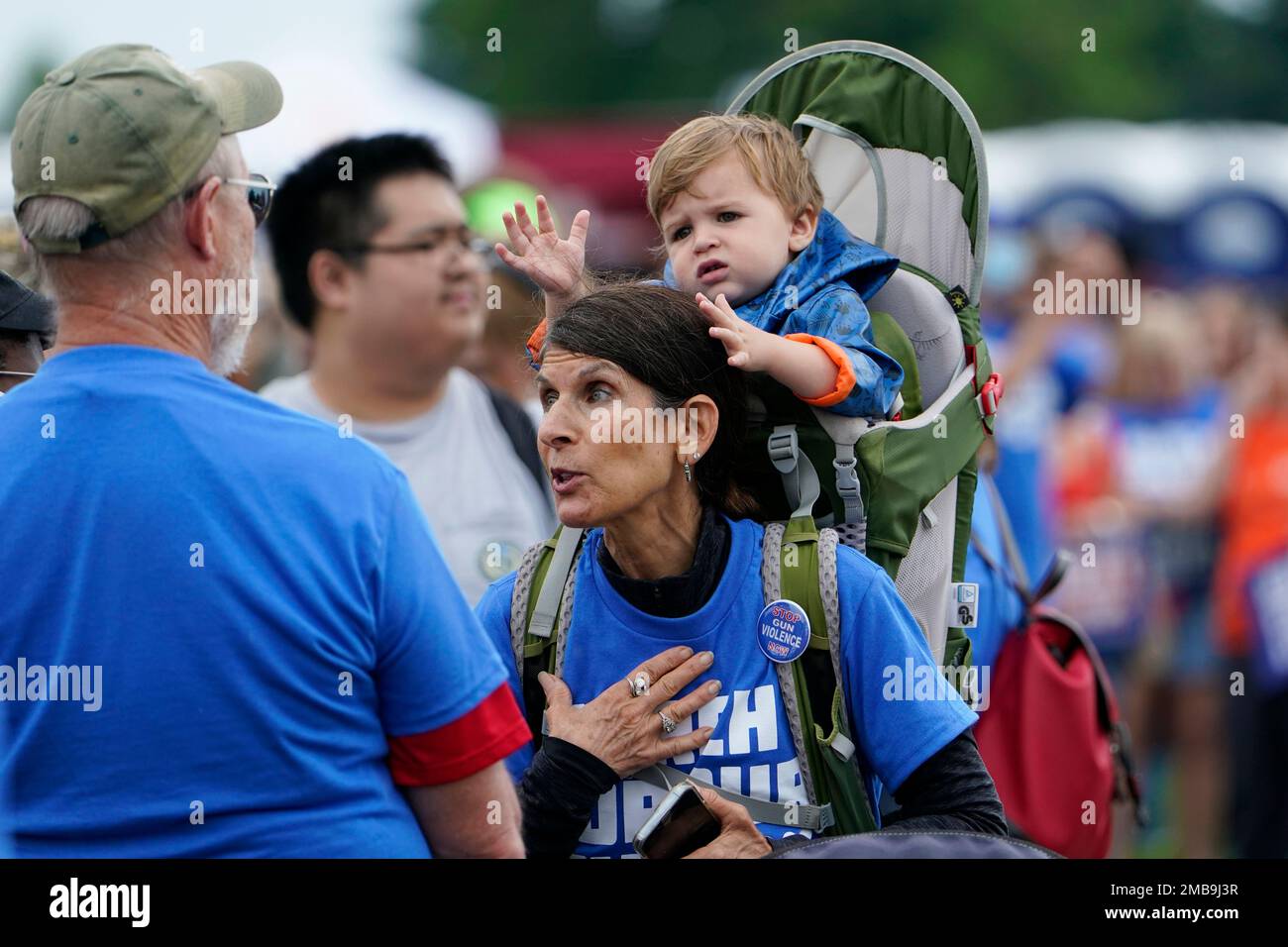 Deborah Plotkin carries her grandson as she attends the second March ...