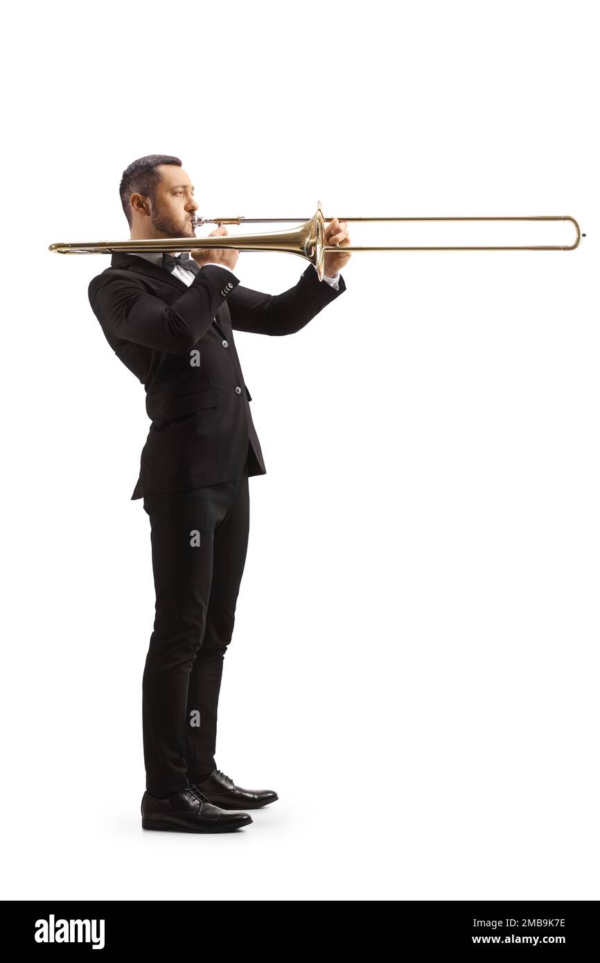 Full length profile shot of an elegant male musician playing a trombone ...