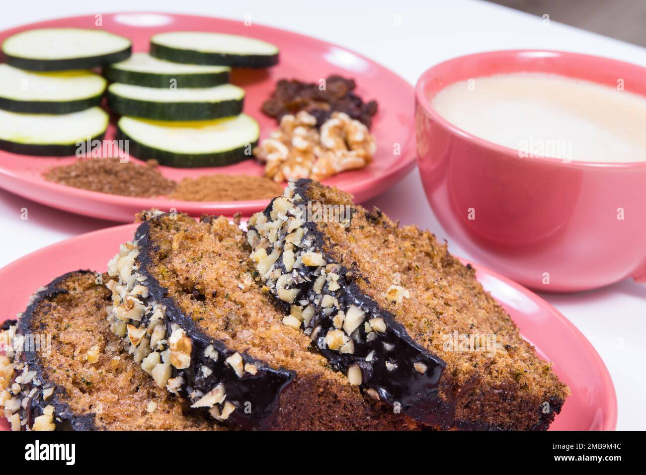 Fresh baked homemade zucchini dough and cup of white coffee. Delicious ...