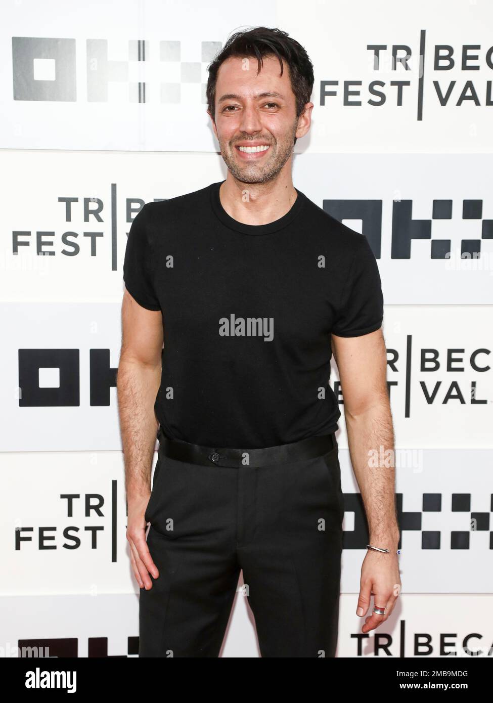 Actor Michael John Benzaia attends the premiere for "Somewhere in ...