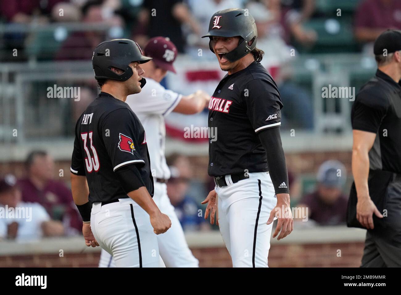 Louisville's Cameron Masterman, right, reacts with catcher Jack Payton ...