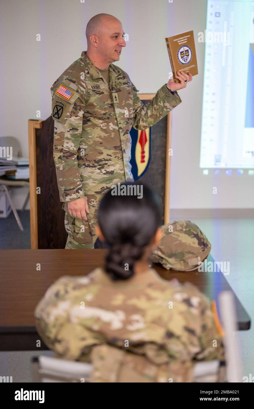 Sfc. Nicholas Huebbe, an observer coach/trainer for Headquarters and ...