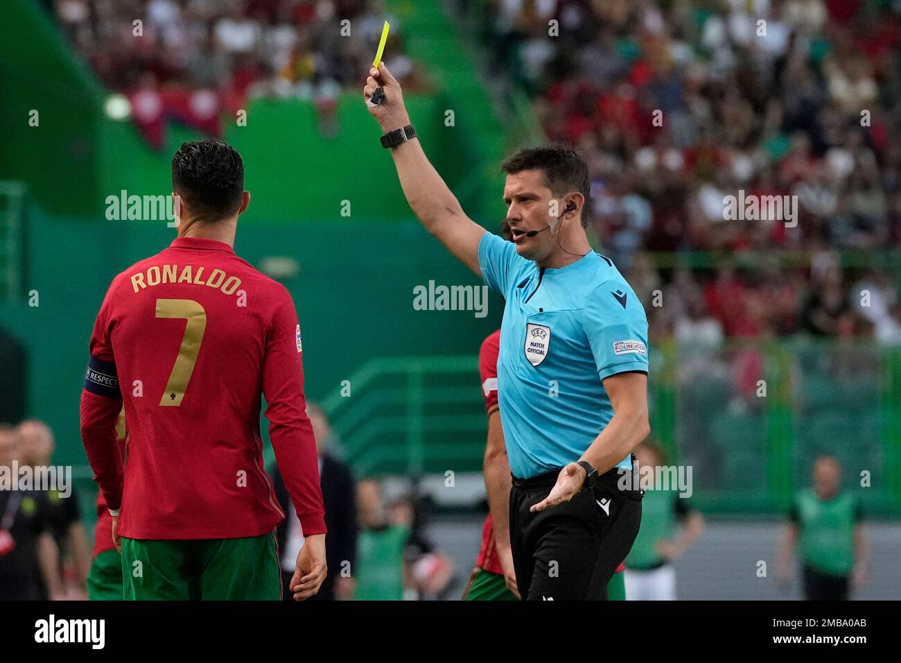 Portugal's Cristiano Ronaldo receives a fellow card by the referee referee Matej Jug during the ...