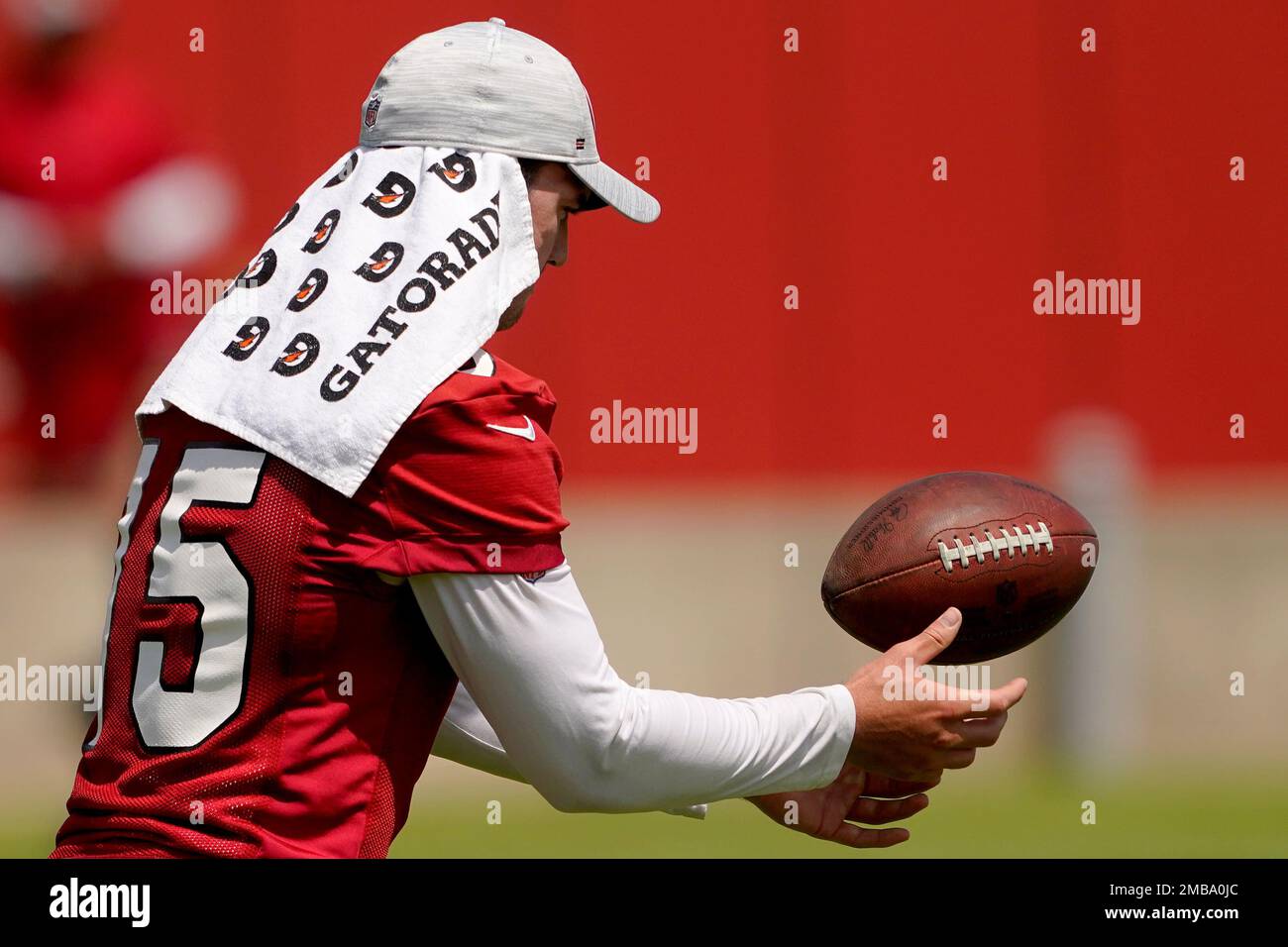 Arizona Cardinals' Nolan Cooney keeps the sun off his neck during the ...