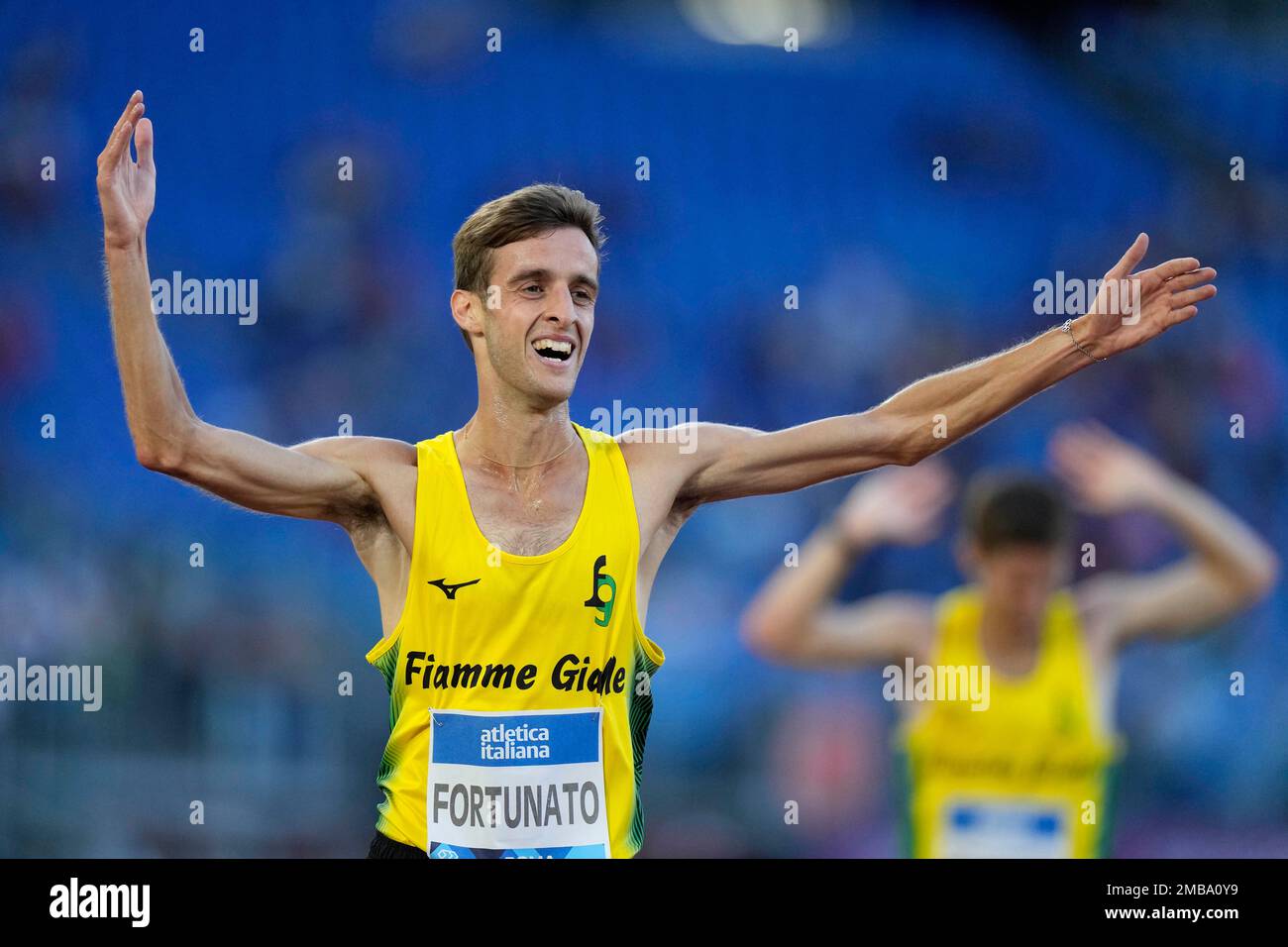 Italy's Francesco Fortunato celebrates after winning the men's 3000 ...