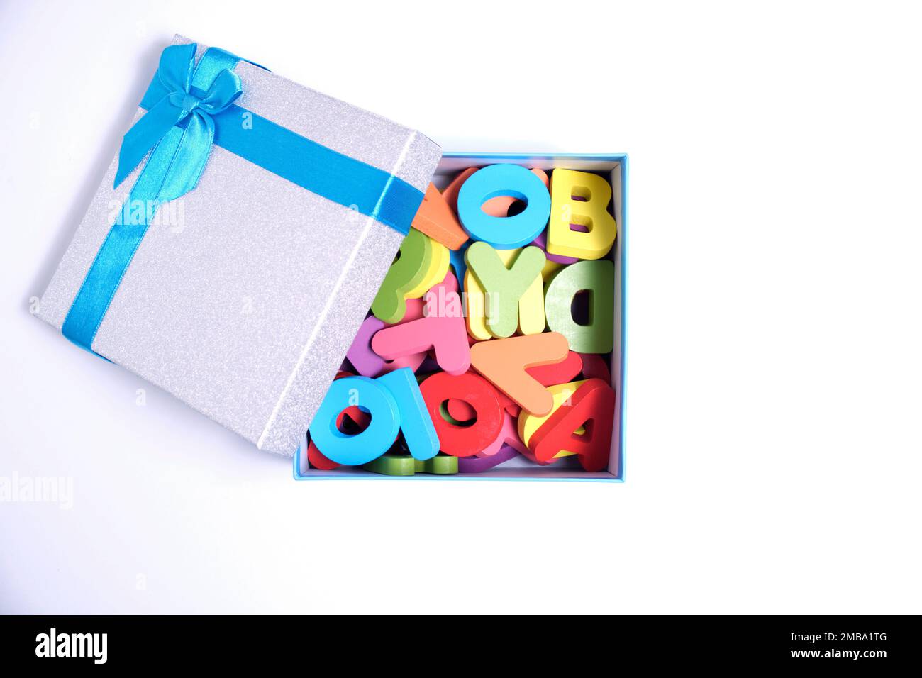 Open box white background, full of letters English alphabet Stock Photo ...