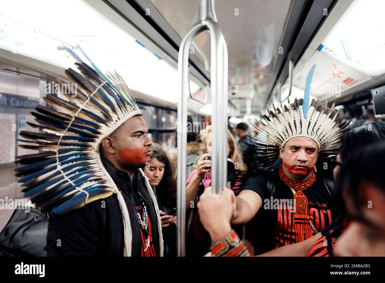 Indigenous representatives from Brazil in the metro after a protest ...