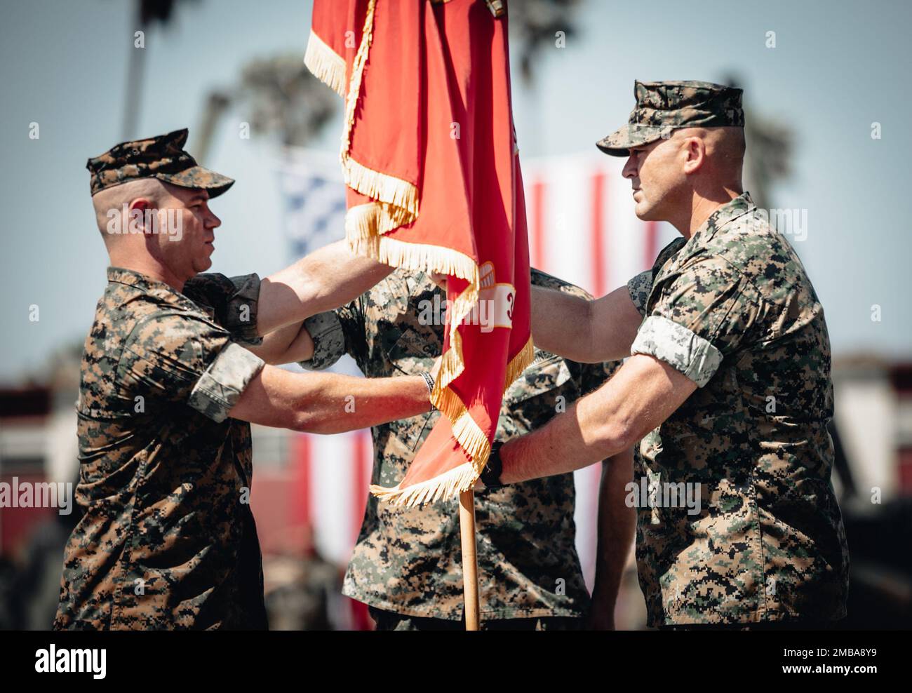 U.S. Marine Corps Lt. Col Daniel R. Petronzio (left) receives the ...