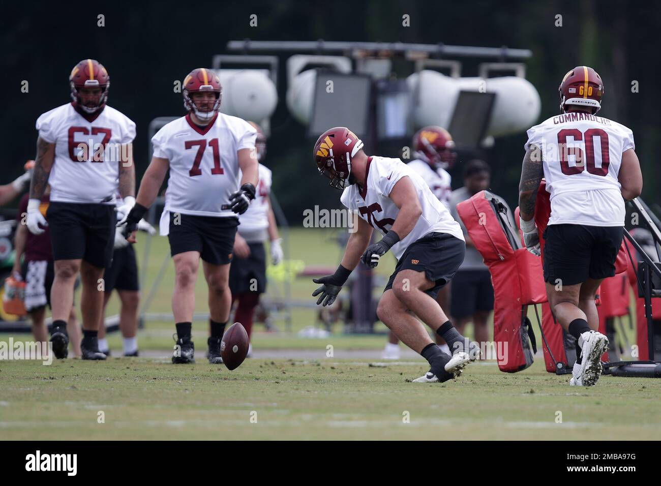 Washington offensive lineman Samuel Cosmi, center, is seen during an ...