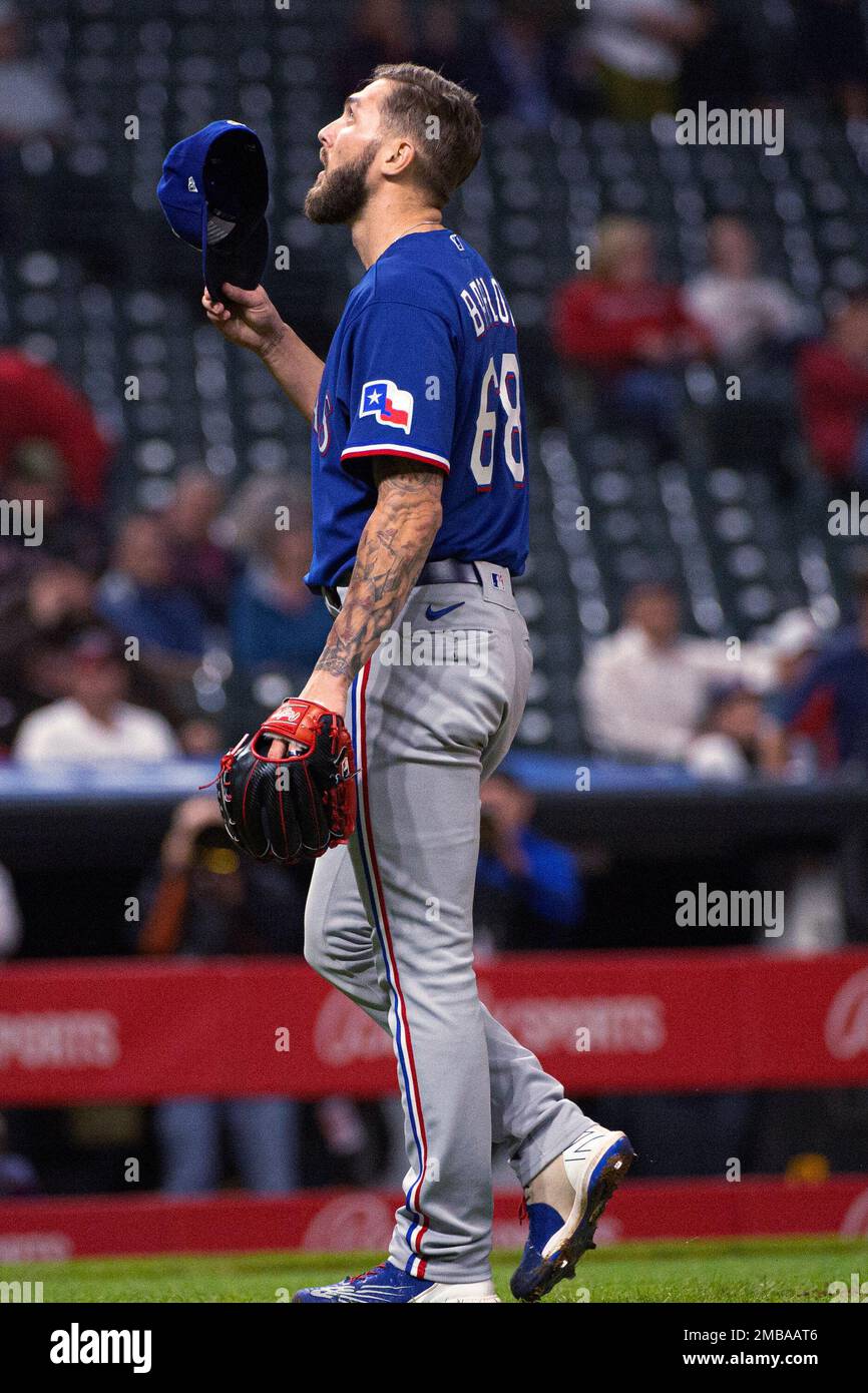 Texas Rangers relief pitcher Joe Barlow doffs his cap after the team's win against the Cleveland ...