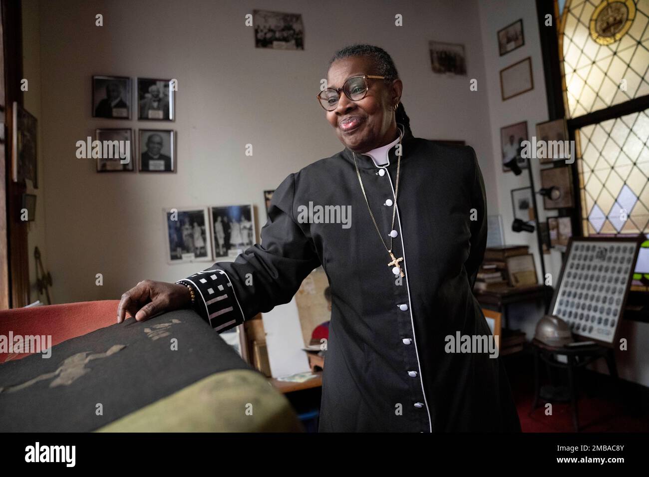 Rev. Monica Marshall browses a room containing artifacts of the church ...
