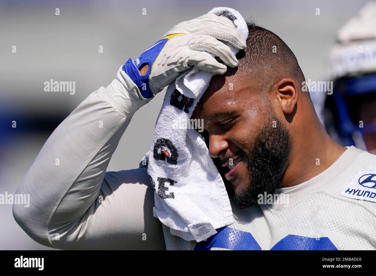 Los Angeles Rams defensive end Aaron Donald wipes his head during an ...