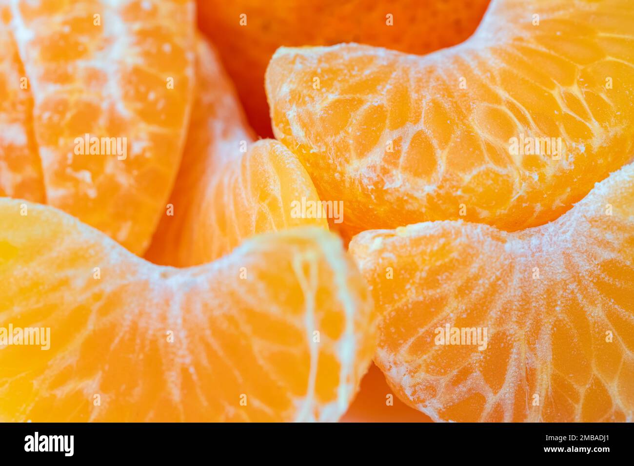 Peeled tangerine fruit segments in a macro, background and texture ...