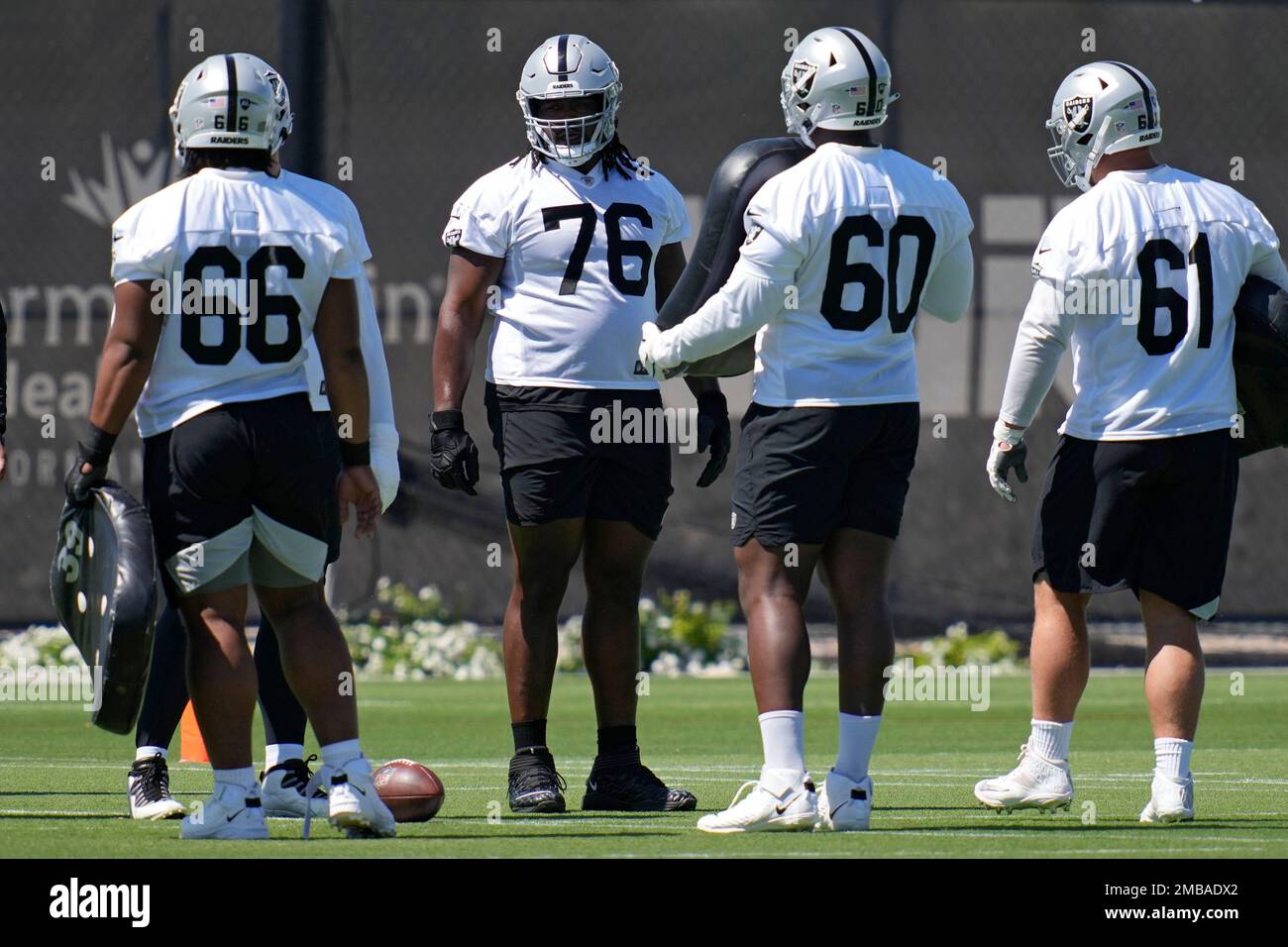 Las Vegas Raiders' John Simpson (76) warms up at the NFL football team ...