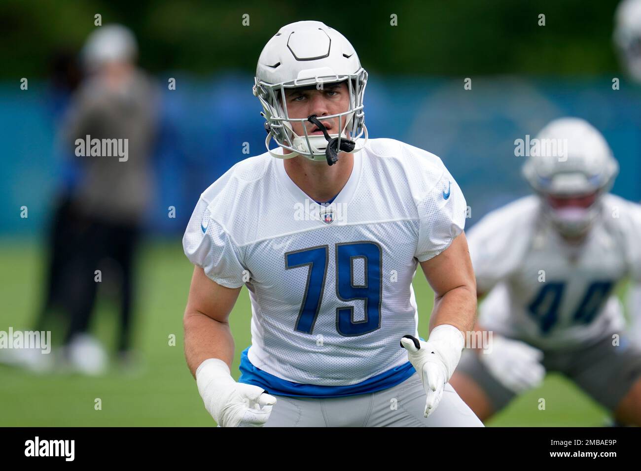 Detroit Lions defensive lineman John Cominsky runs a drill during an ...