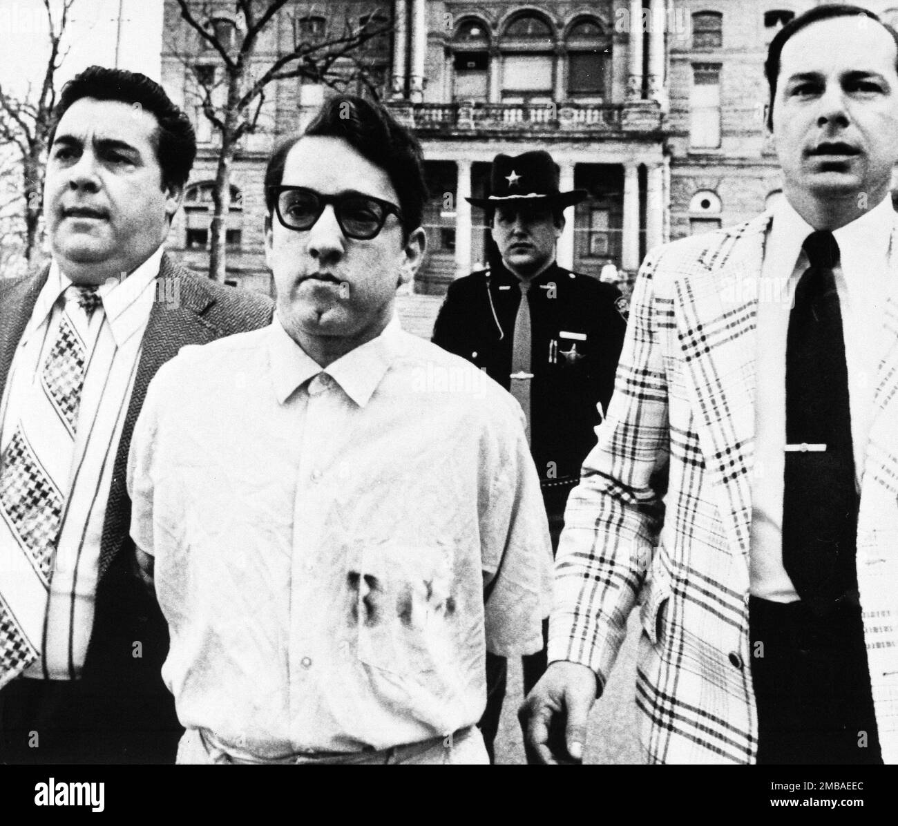 FILE - Mass murderer James Ruppert, center, is taken back to jail after ...