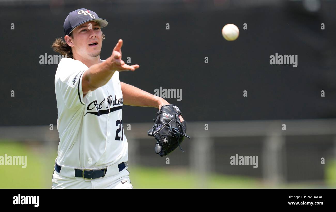 Oral Roberts infielder Isaac Coffey (27) toss the ball to first base ...