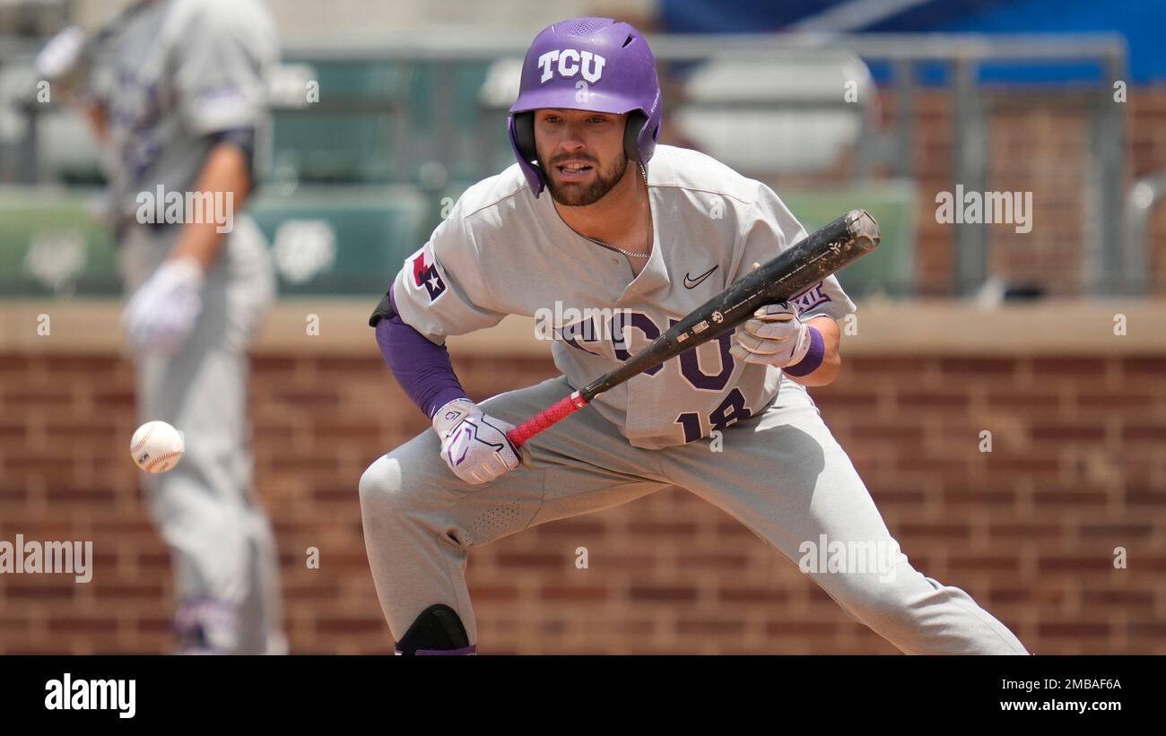 TCU infielder Bobby Goodloe (18) tries to lay down a bunt against Oral ...