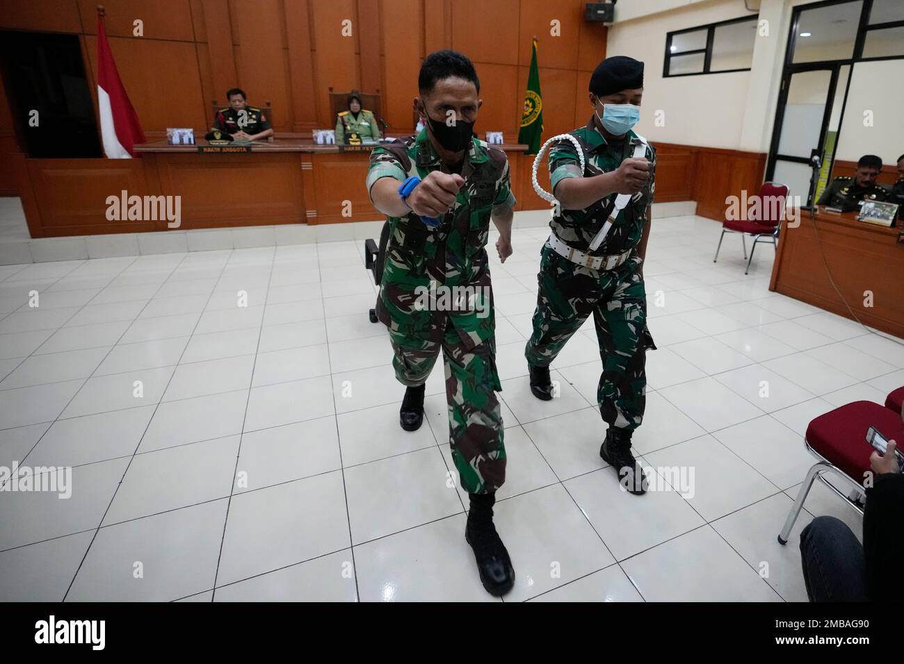 Colonel Priyanto, a mid rank army officer, walks after his trial at the ...