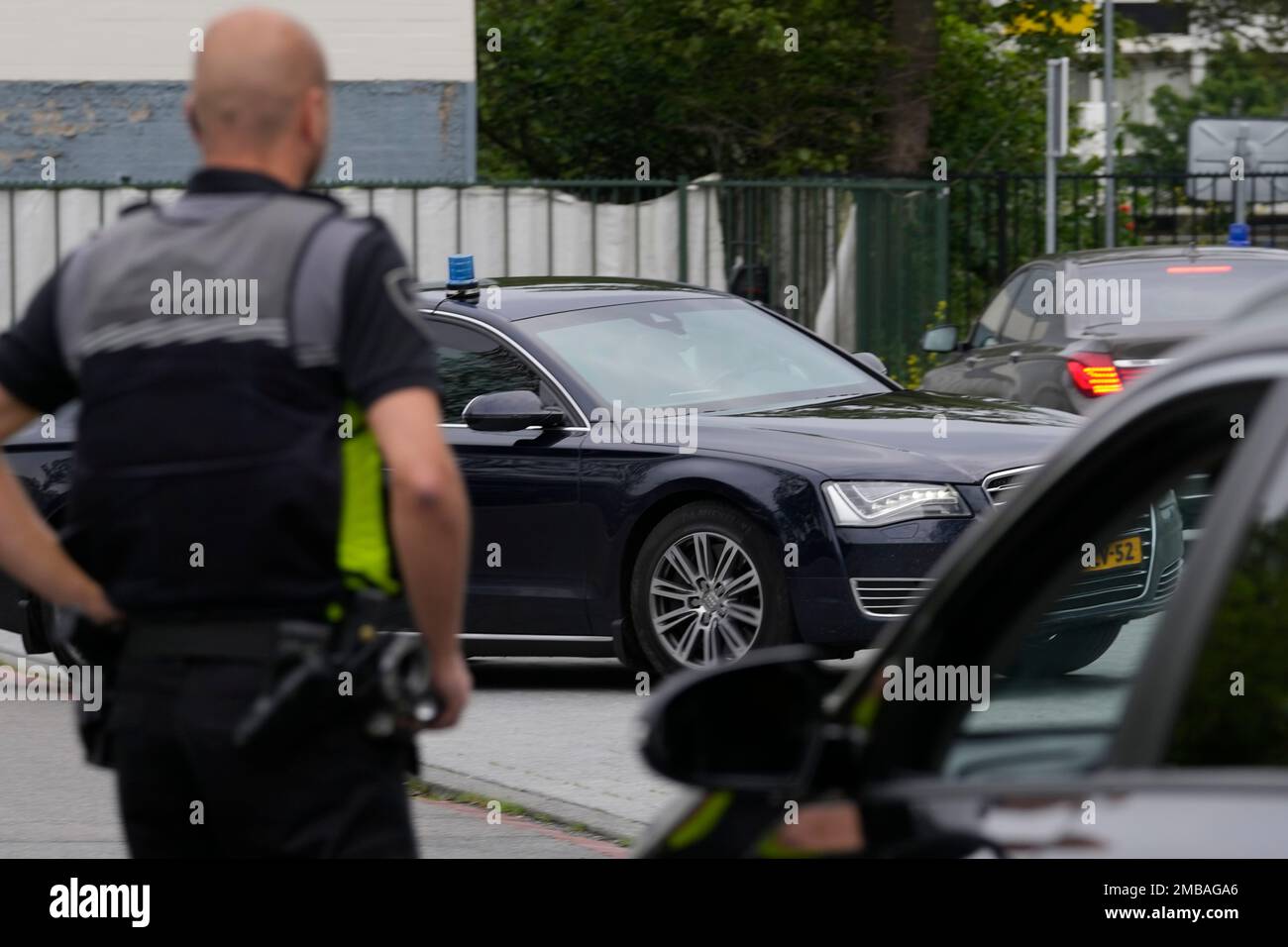 An undercover police vehicle arrives at the court where the trial with ...