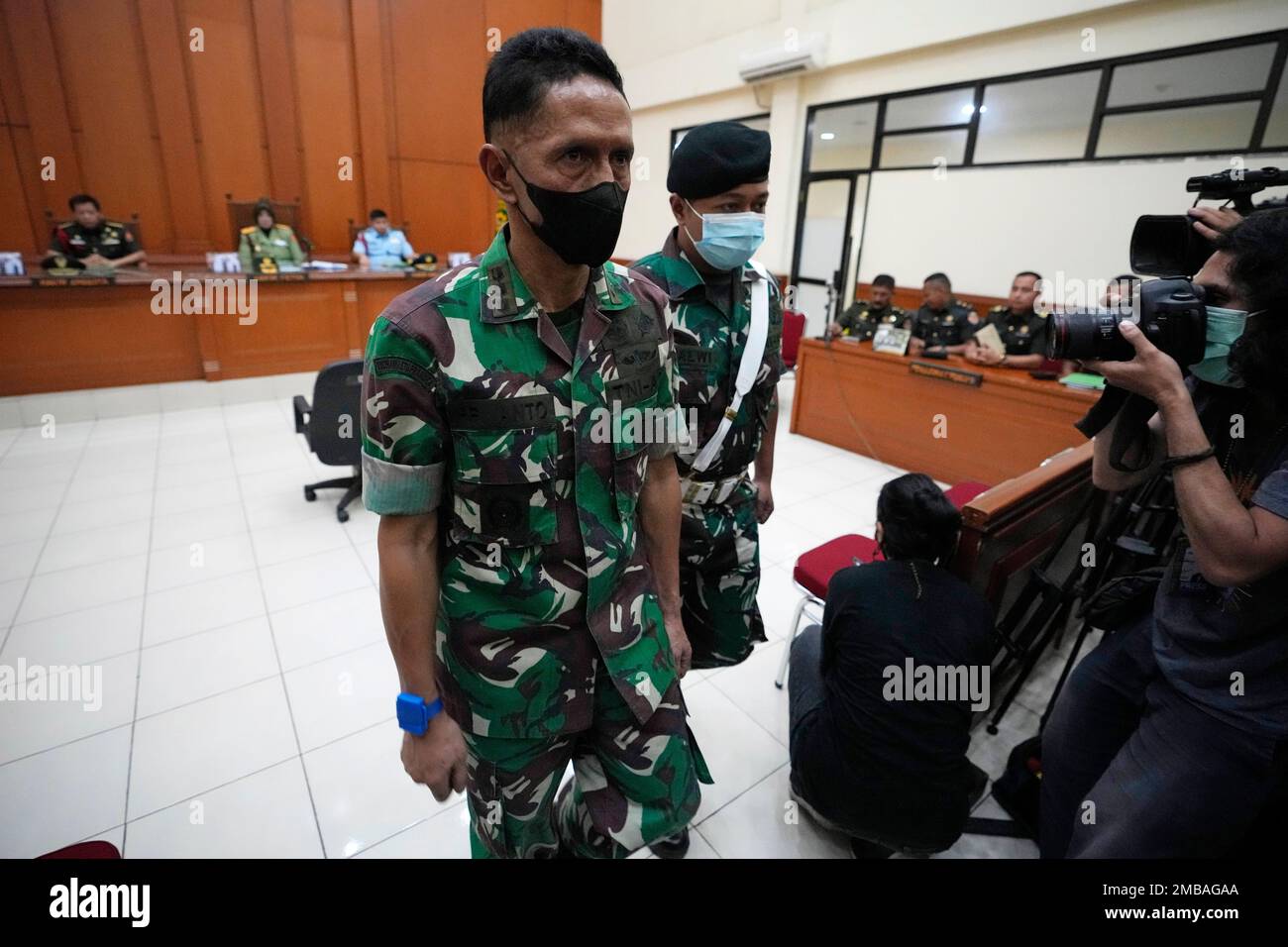 Colonel Priyanto, a mid rank army officer, walks in a courtroom after ...
