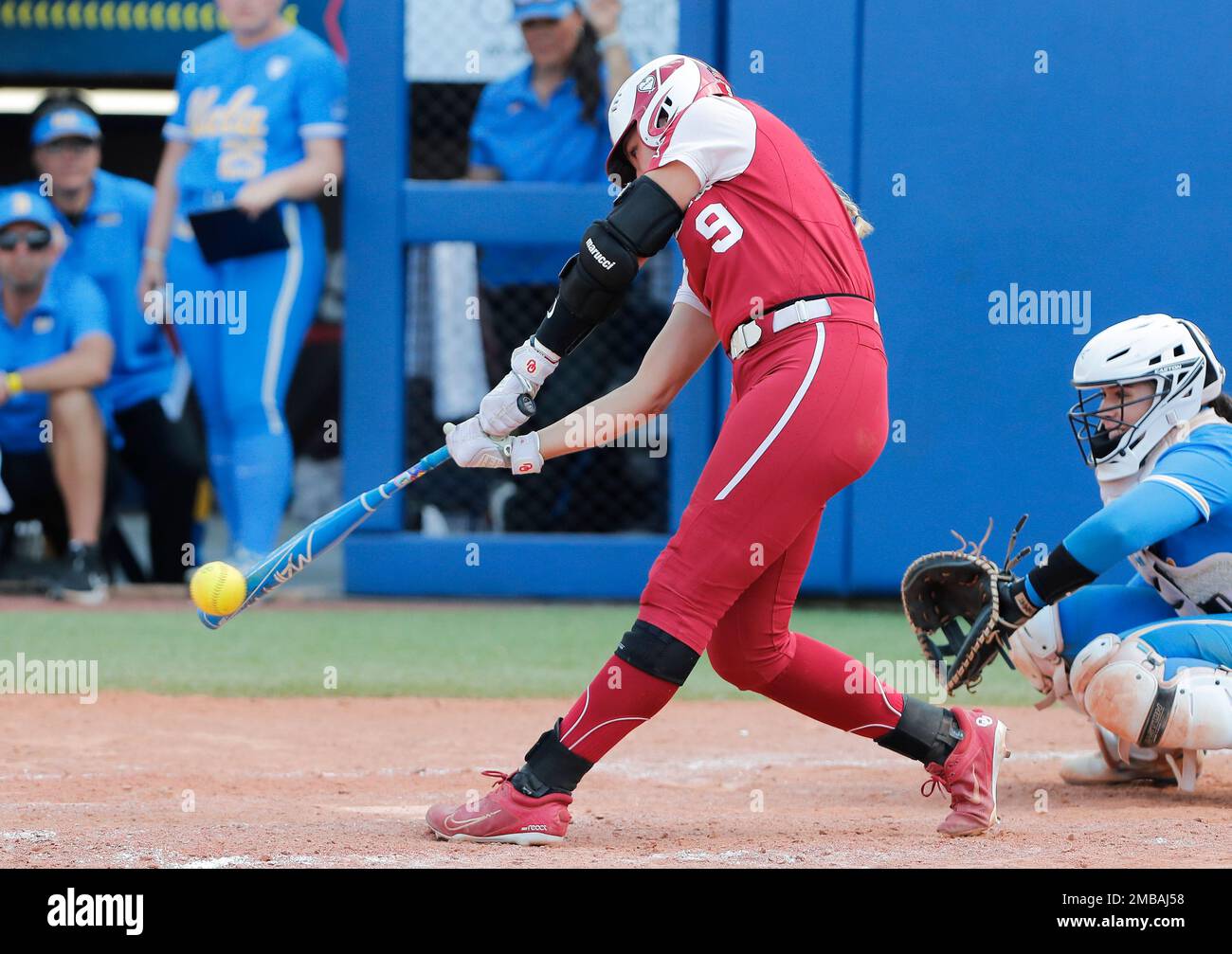 Oklahoma's Kinzie Hansen (9) hits a single during the fifth inning of ...