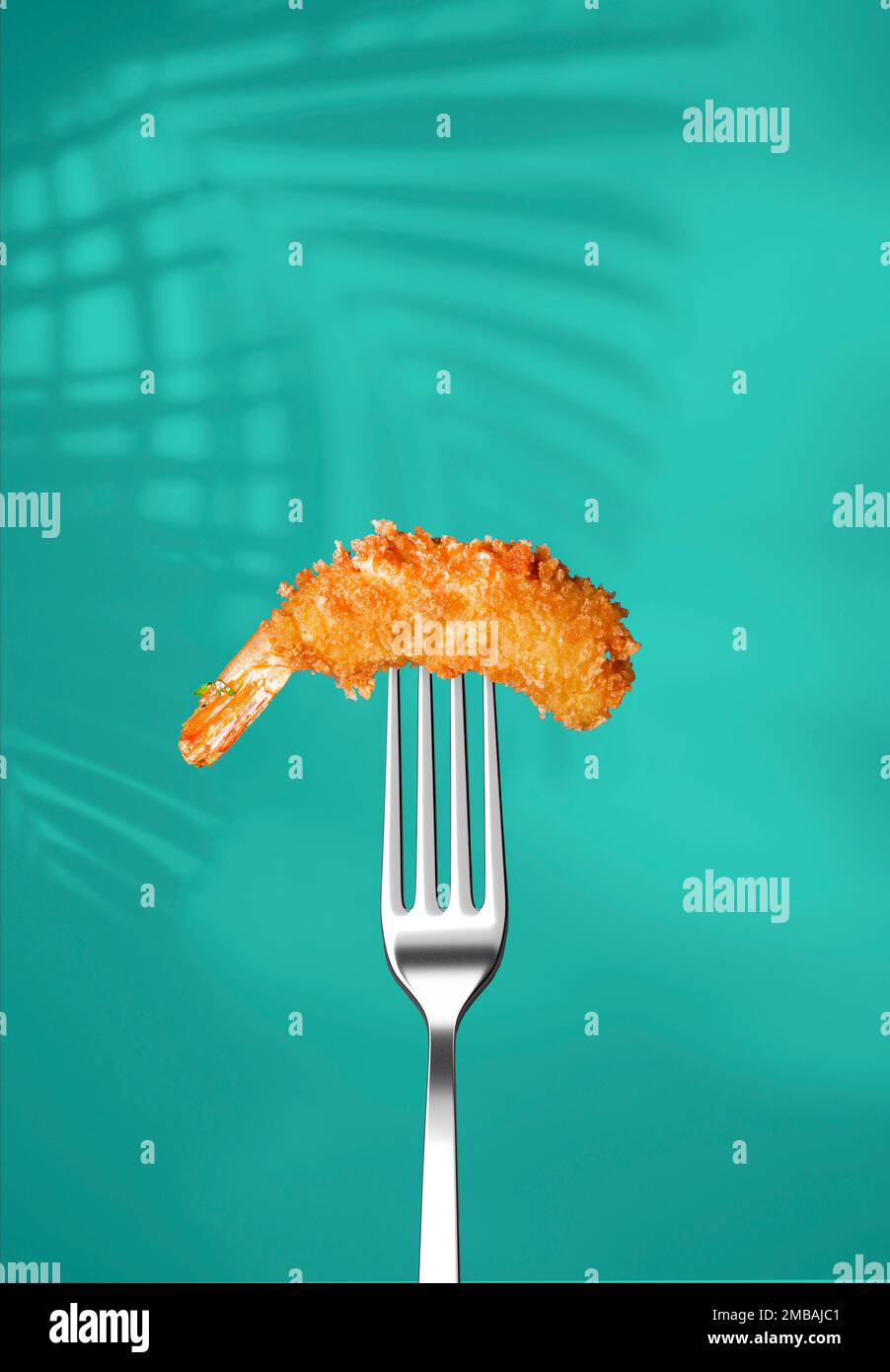 Fried shrimp in panko on a fork isolated on a blue background. Poster ...