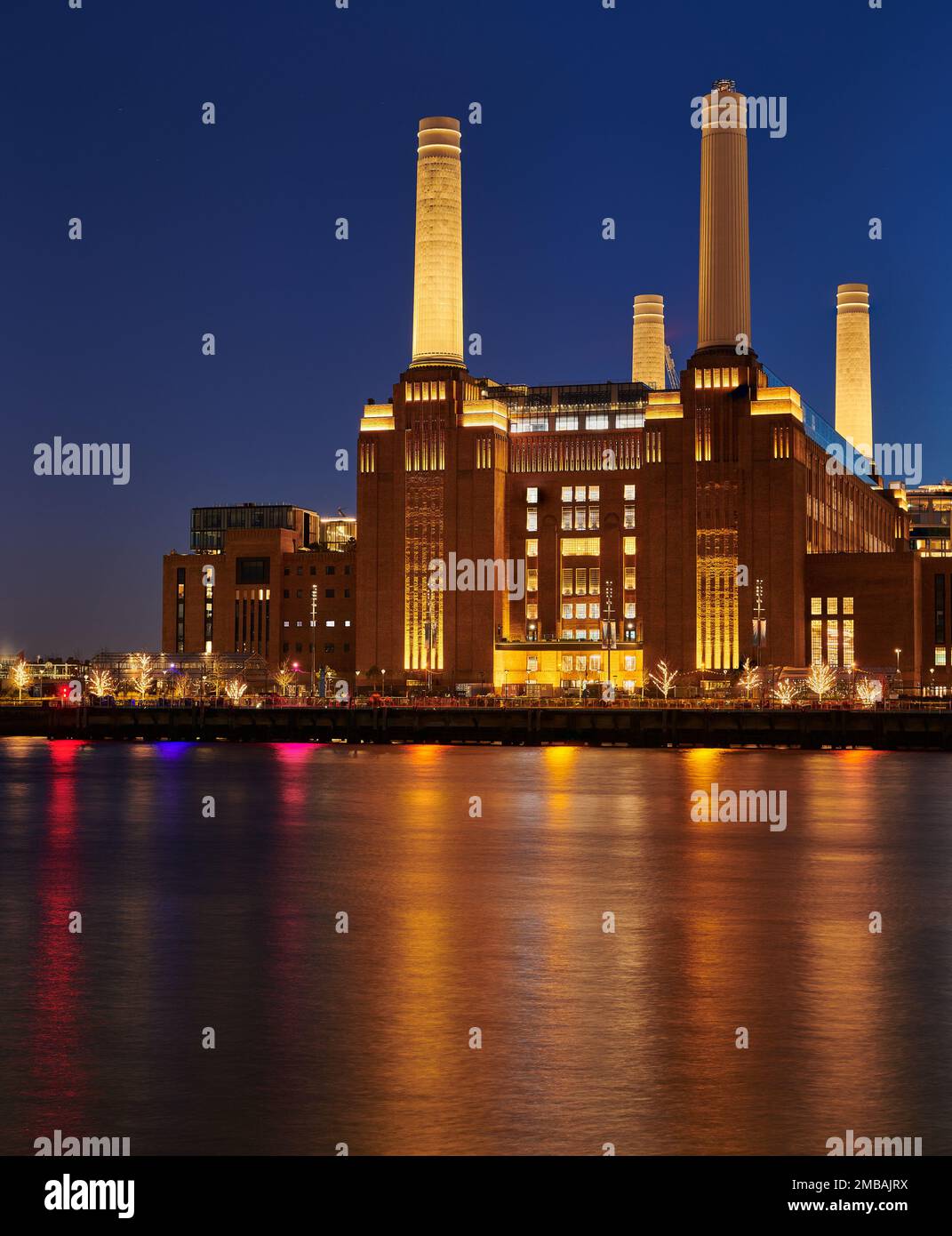 Lit at night, the disused coal fired Battersea Power Station, now a ...